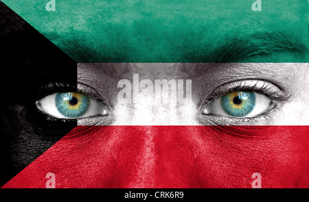 Human face painted with flag of Kuwait Stock Photo - Alamy