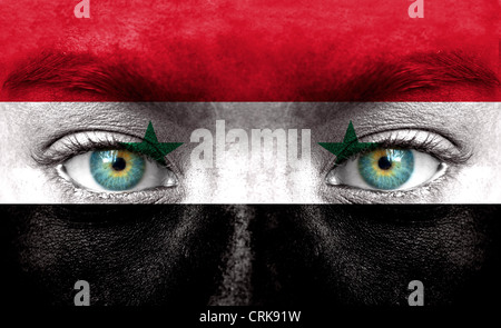 Human face painted with flag of Syria Stock Photo - Alamy