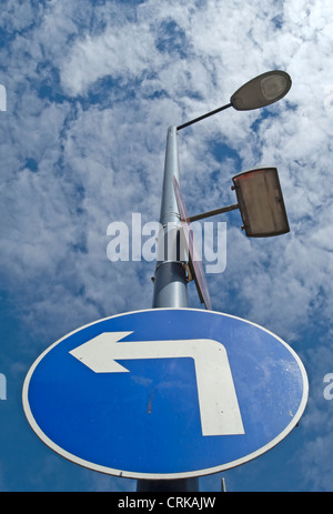Turn left ahead road sign, blue round isolated roadside traffic Stock ...