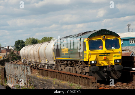 Freightliner locomotive hauling containers along a railway line in ...