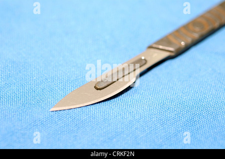 Close up of medical scalpel on white background. Scalpel is used for ...