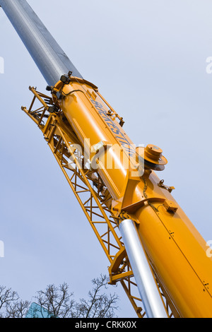 Crane with yellow telescopic arm of a big tower crane Stock Photo - Alamy