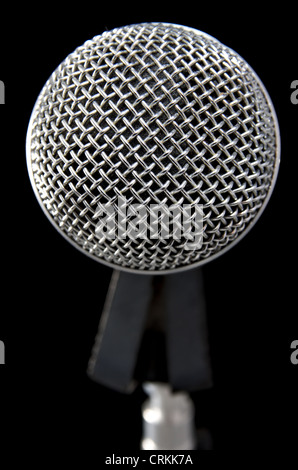 Silver shiny microphone on audio mixer in studio top view Stock Photo ...