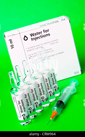 Medical background with syringe and glass ampoules, stethoscope Stock ...