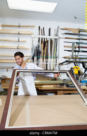 Craftsman making frame in workshop Stock Photo - Alamy