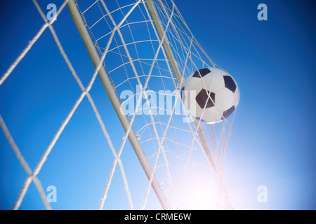 Soccer ball going into goal net Stock Photo: 49139666 - Alamy