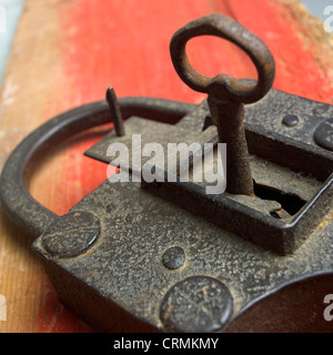 Old rusty keys inside a keyhole of an old antique closet. vintage ...