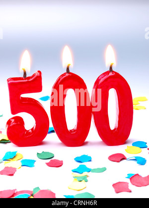 Number 500 anniversary candle - Celebration on yellow background Stock ...