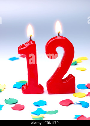 Burning birthday candles number 12 Stock Photo: 67142320 - Alamy