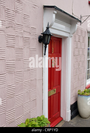 Red door with a number, letterbox and door knocker Stock Photo - Alamy