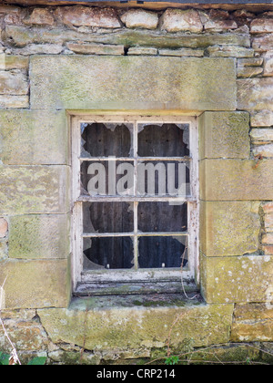 Abandoned stone cottage broken window detail Stock Photo - Alamy