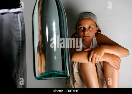 A young girl cowering away from her attacker Stock Photo - Alamy