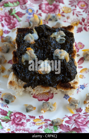 Welsh Breakfast of Laver Bread on Toast with Cockles Stock Photo - Alamy