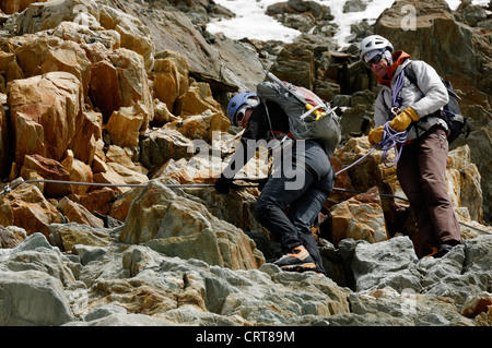 Two climbers descending the Gouter ridge on Mont Blanc Stock Photo - Alamy