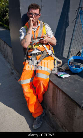 Portrait of a construction worker smoking a cigarette. Hanoi, Vietnam ...