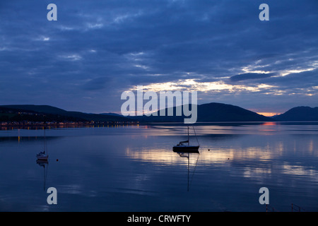 Rothesay bay at sunset with a yacht moored up and Loch Striven in Cowal ...