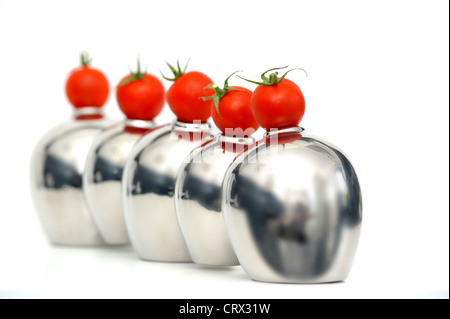 tomatoes in a silver ornament Stock Photo - Alamy