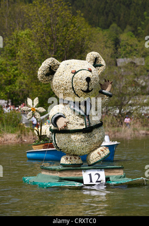 Austria, Styria, People celebrating daffodil festival on Lake Altaussee ...