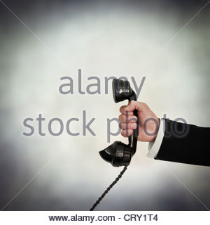 Hand about to answer the phone Stock Photo: 52014182 - Alamy