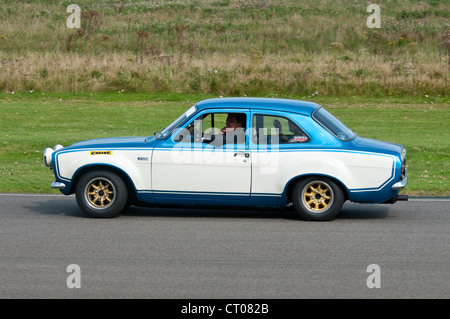 1970 Ford Escort MK1 RS1600 rally car on the forest stage with driver ...