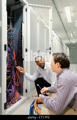 Information Technology. IT wires into mainframe Stock Photo - Alamy