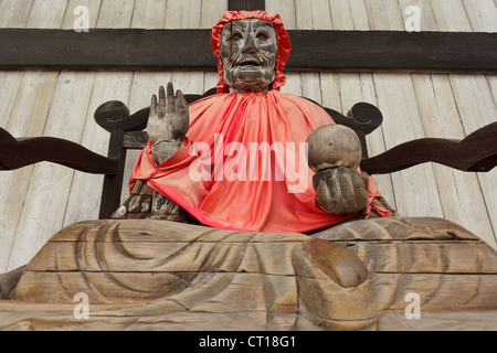 The wooden statue of Binzuru (Pindola Bharadvaja) at the entrance of ...