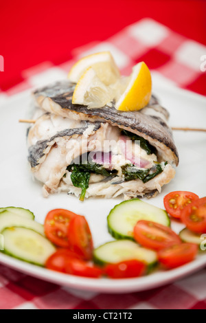Steamed blue grenadier fish filled with spinach, red onion and feta on ...