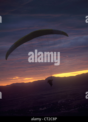 Paragliding with sunset Stock Photo - Alamy