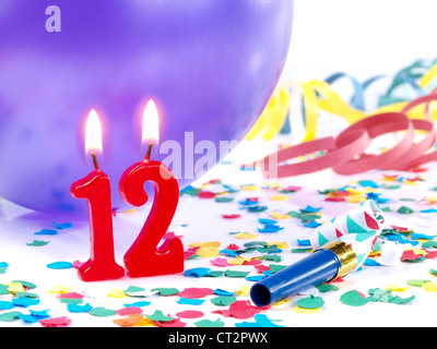 Burning birthday candles number 12 Stock Photo: 67142320 - Alamy
