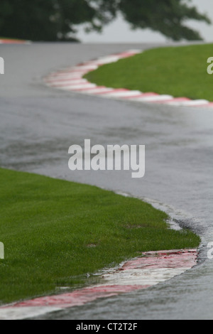 Wet racetrack corner Stock Photo - Alamy