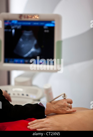 Ultrasound medical device for diagnostics, female doctor hands on the ...