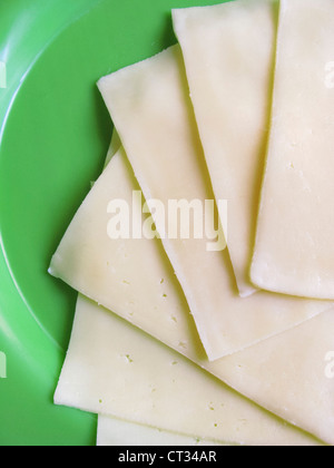 Slices of cheese on plate, traditional swiss raclette pieces Stock ...
