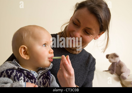 INFANT TAKING MEDICATION Stock Photo - Alamy
