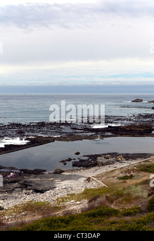 The tidal marine pool and Walker Bay at Hermanus, South Africa Stock ...