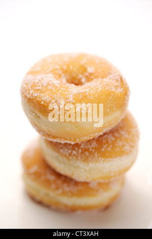 Three golden donuts isolated on white background Stock Photo - Alamy