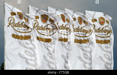 Flags with the Radeberger Pilsner logo in the wind Stock Photo - Alamy