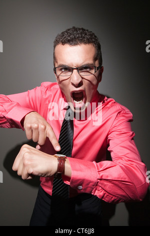 Aggressive young businessman pointing Stock Photo - Alamy