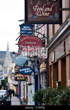 Multi-coloured shop fronts with interesting street signs in Kenmare ...