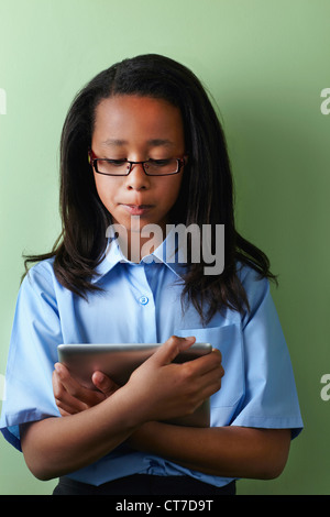 Studio shot of schoolgirl (6-7 years Stock Photo - Alamy