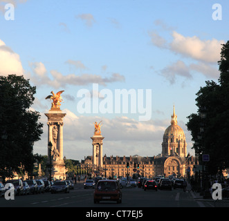 Pont Alexandre III and Les Invalides at night illumination in Paris ...