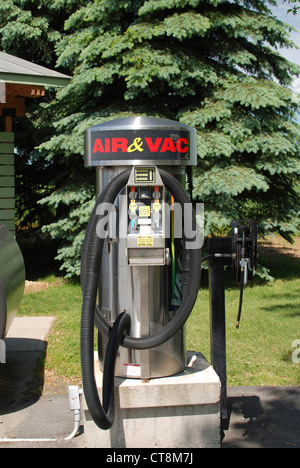 A coin operated car vacuum and air machine at a gas station in ...