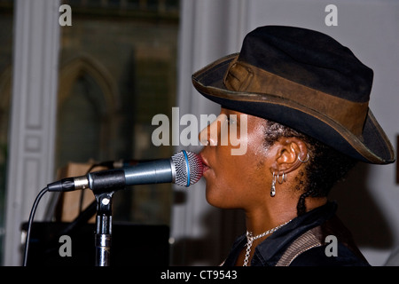 Female African-American rhythm and blues musician singing on stage ...