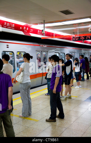 Line 1 platform & Chinese commuters / commuter passengers boarding a ...