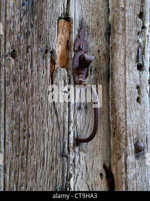 old plank door with metal latch, corrugated iron next to it Stock Photo ...