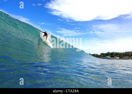 Surfing at Lagundri Bay on Nias island in Sumatra, Indonesia Stock ...