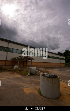Boarded up commercial property warehouse Stock Photo - Alamy