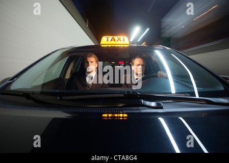 A taxi driver inside his car at night in Shinjuku, Tokyo, Japan Stock ...