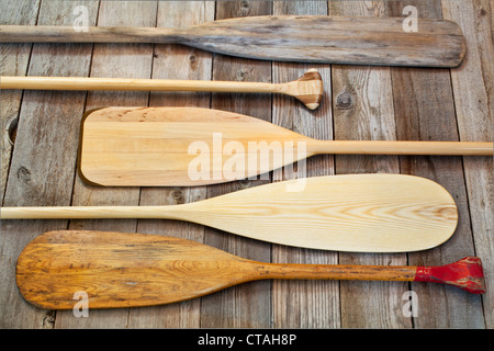 blades and grips of wooden canoe paddles, a variety of styles and ...