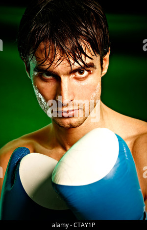Man sweating all over in boxing gloves Stock Photo - Alamy