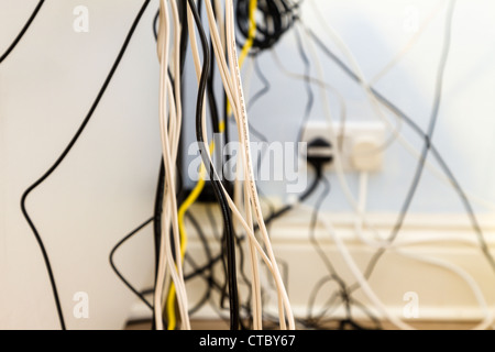 Untidy office cables and wires Stock Photo - Alamy